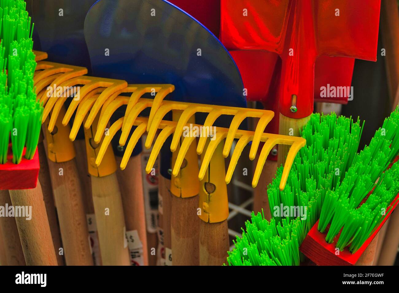 Garden tools on display in afternoon light at the local garden center ...