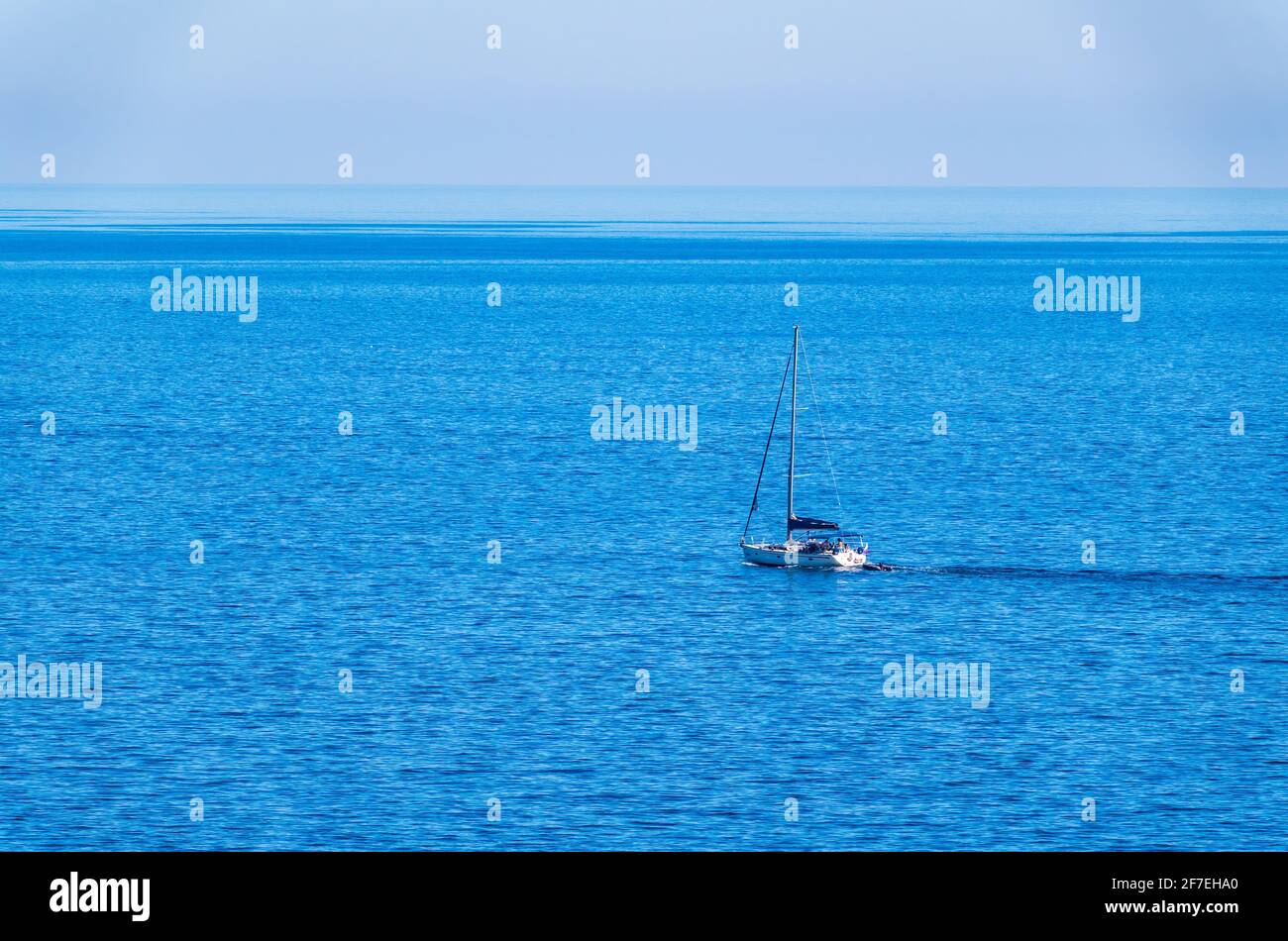 Sailing yacht in the blue calm sea. A yacht in peaceful waters Stock ...