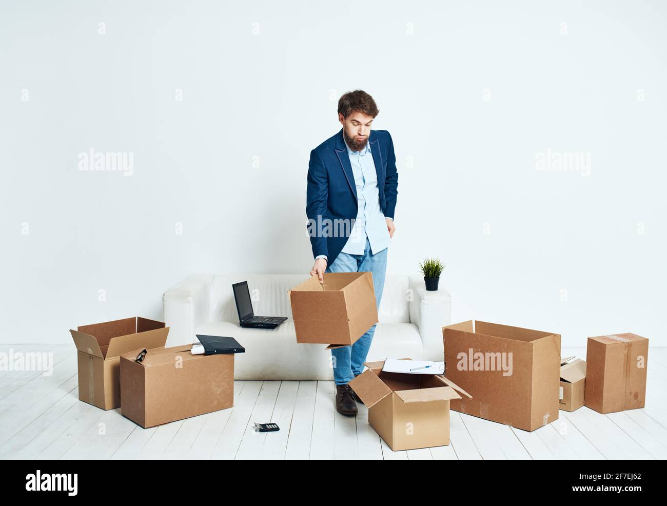 Business man in a suit boxes in hands picking things moving Stock Photo ...
