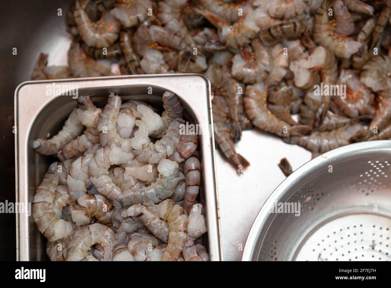 Many peeled raw headless large shrimps without shell Stock Photo - Alamy