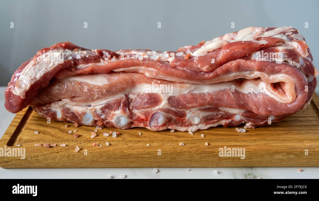 pig meat lying on a cutting board ready for further cooking Stock Photo ...