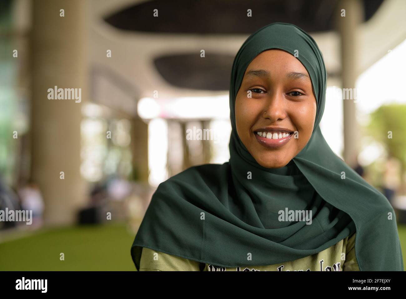 Portrait of beautiful black African Muslim woman smiling outdoors Stock ...