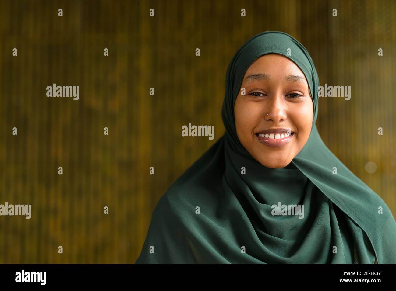 Portrait of beautiful black African Muslim woman smiling outdoors Stock ...