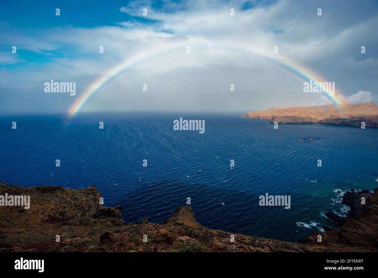 Rainbow above island hi-res stock photography and images - Alamy