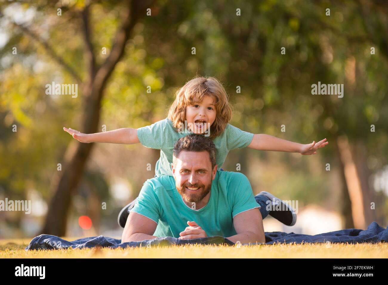 Father and son spending time outdoor together. Happy men family concept ...