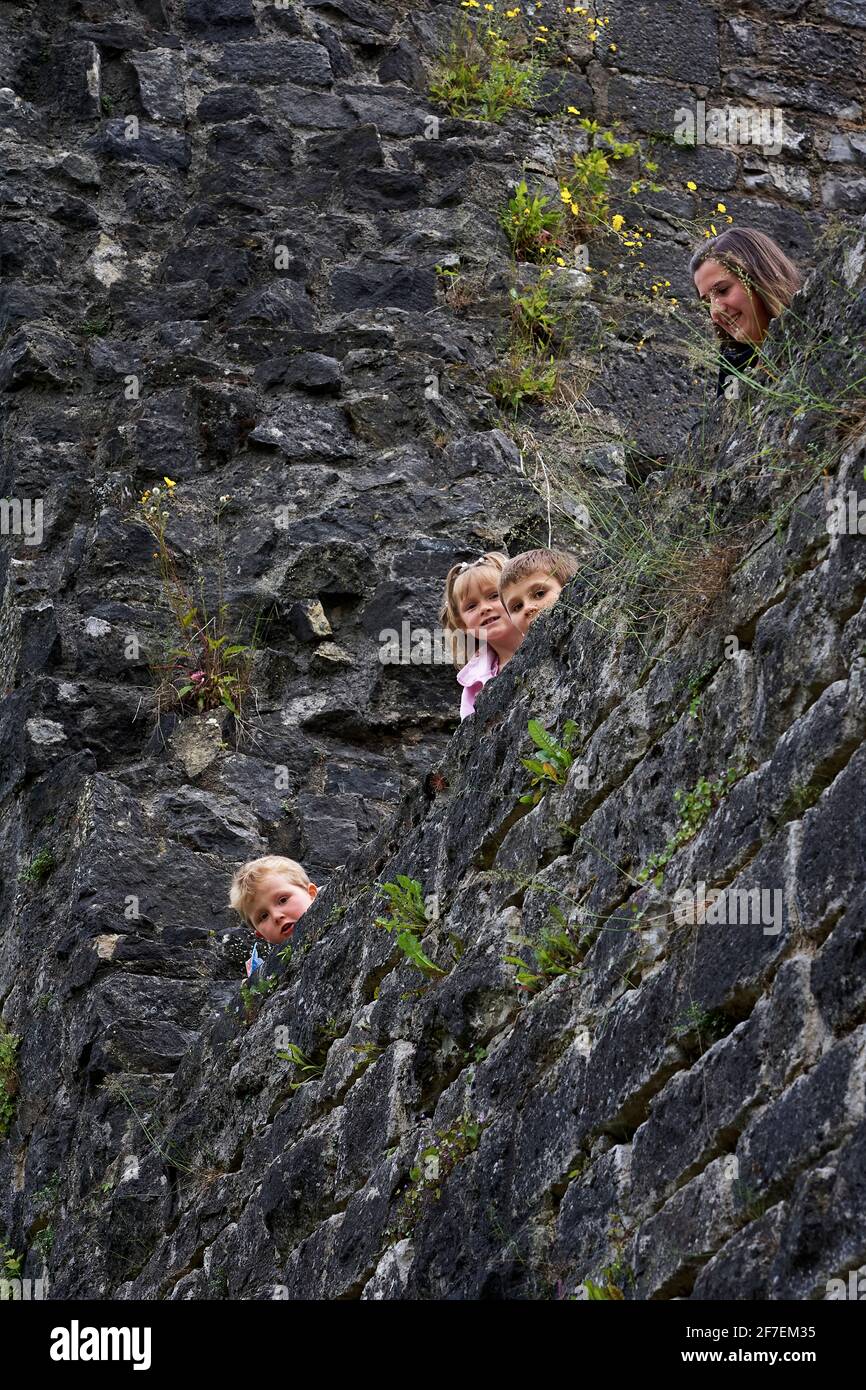 Kids looking over the wall from up above enjoying their tour of the ...