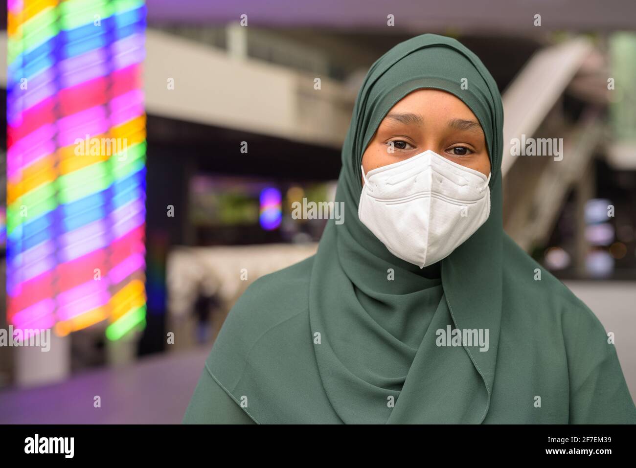 Beautiful black African Muslim woman wearing face mask outdoors Stock ...