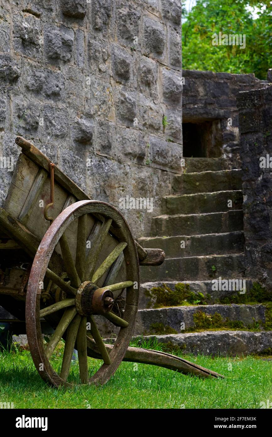 Medieval cart standing alone inside the walls of castle Burgruine ...