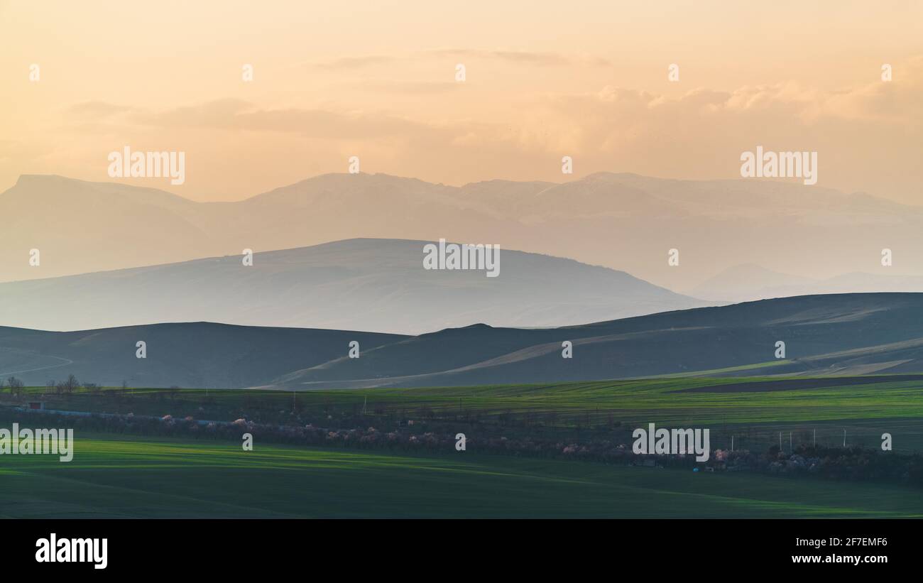 Mountain layers at sunset landscape Stock Photo - Alamy