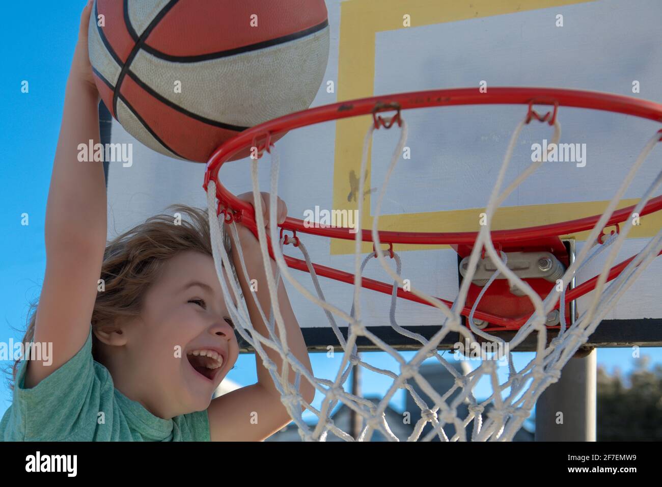 Basketball kids game. Cute little child boy holding a basket ball ...