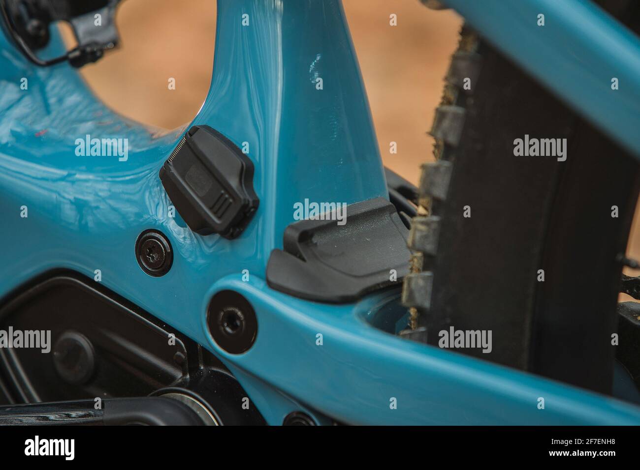 Details of electric mountain bicycle in blue color. Visible charging ...