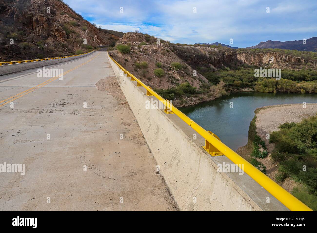 Bridge and road that crosses the river as it passes through the ...