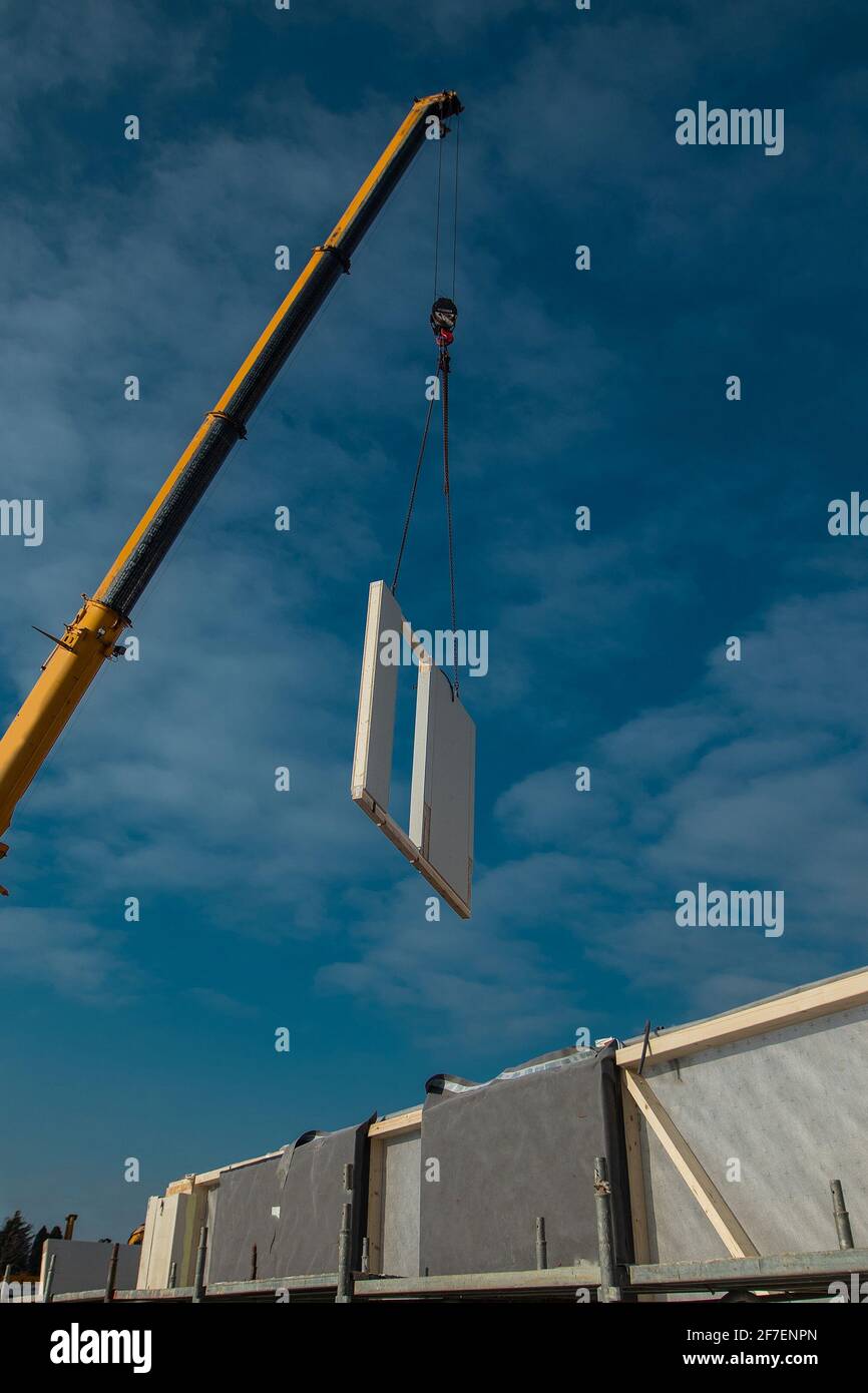 Building a prefabricated wooden house - raising or hoisting house ...