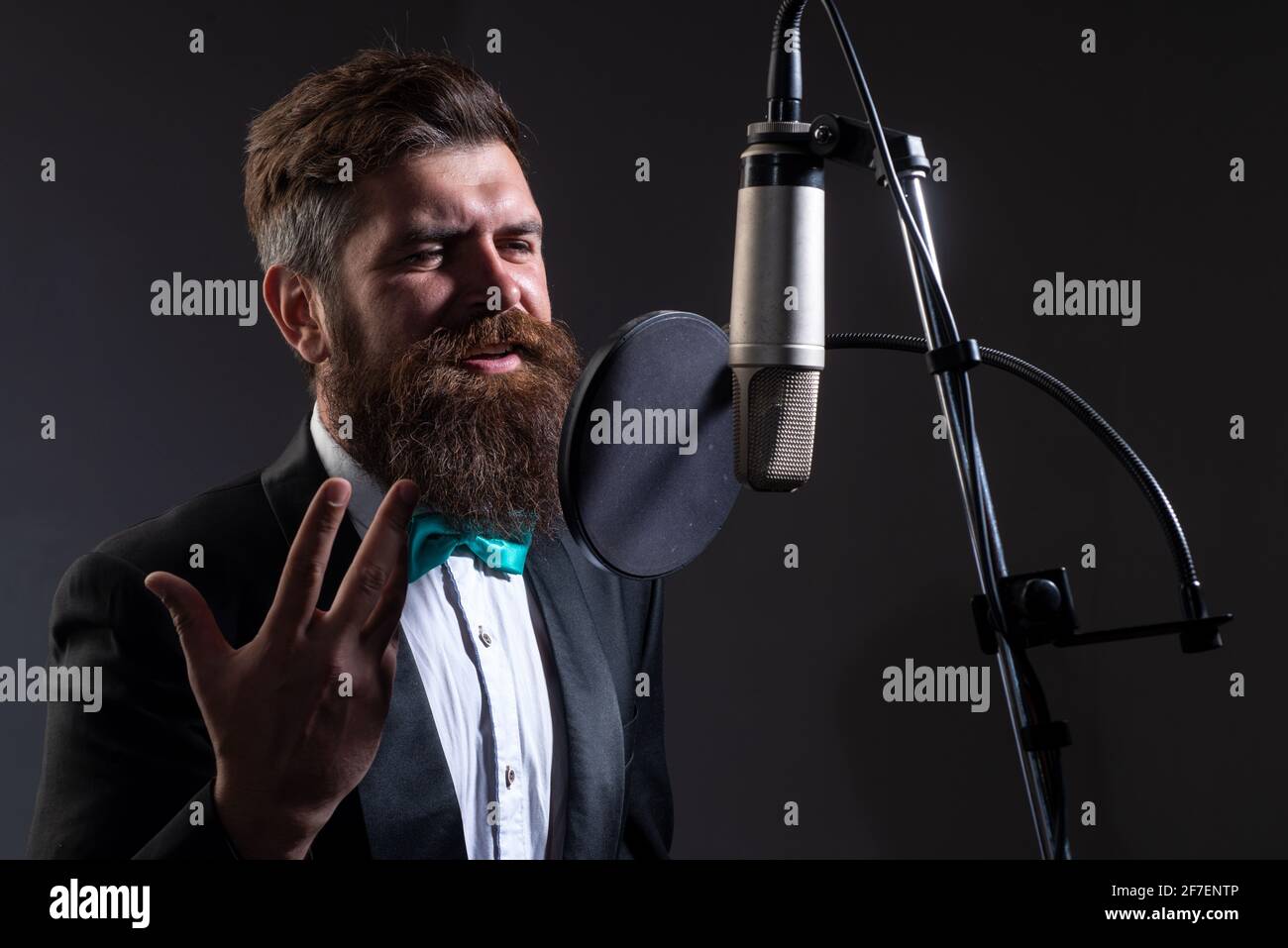 Singer singing classical music. Sound producer recording song in a ...