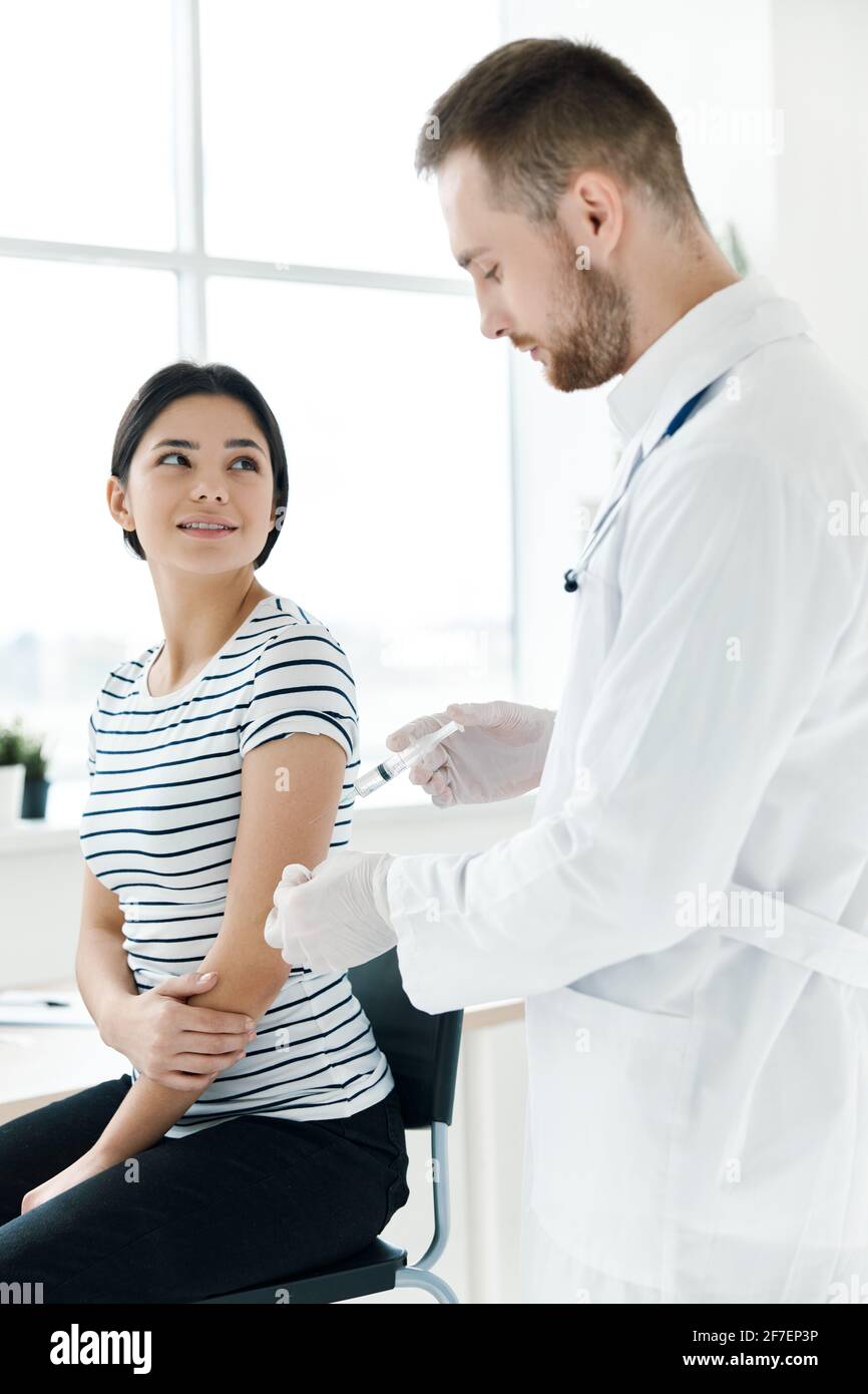 Mature woman getting vaccinated hi-res stock photography and images - Alamy