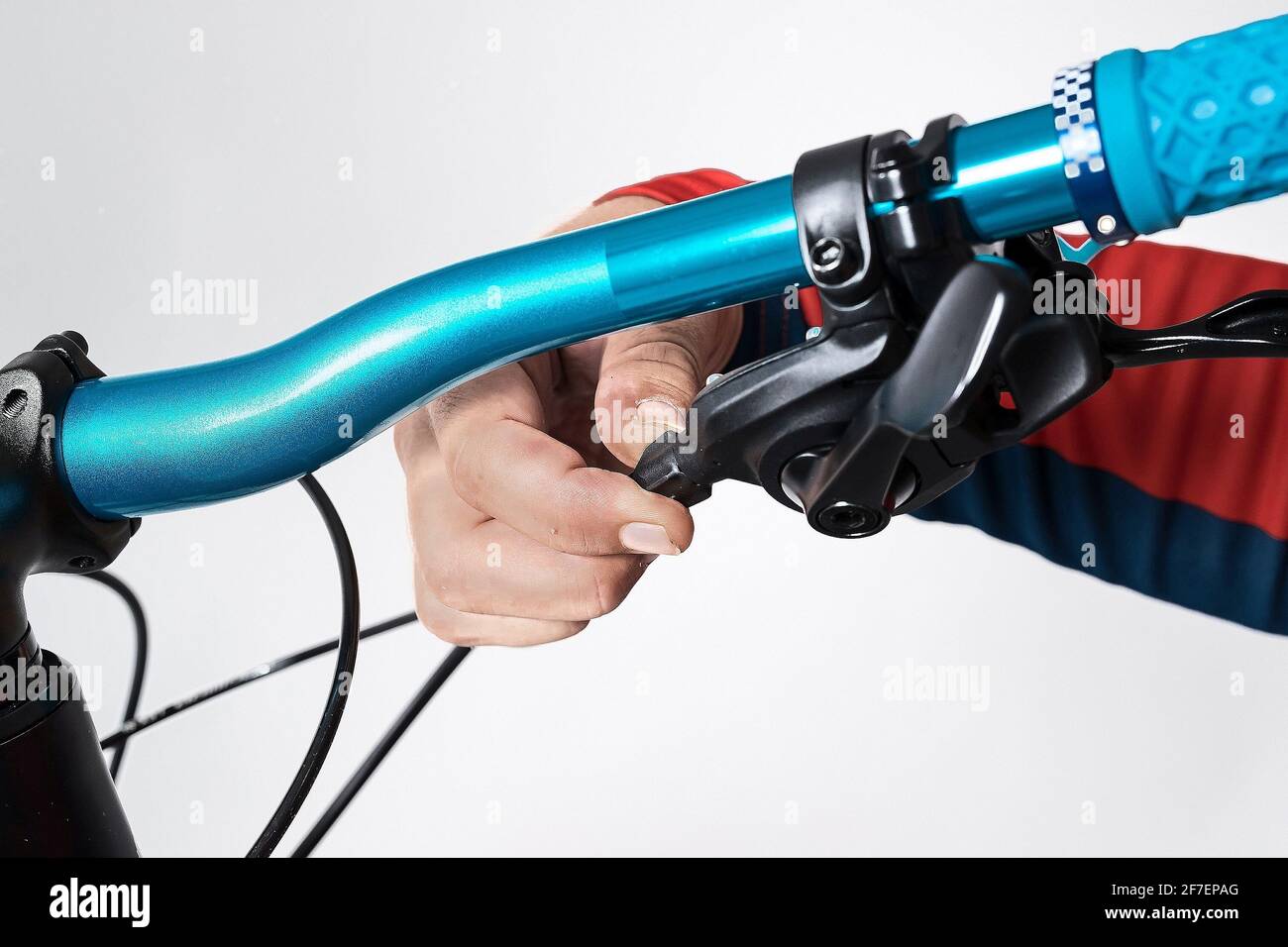 Bicicle repair or maintenance. Adjustment of rear deraileur or gear ...