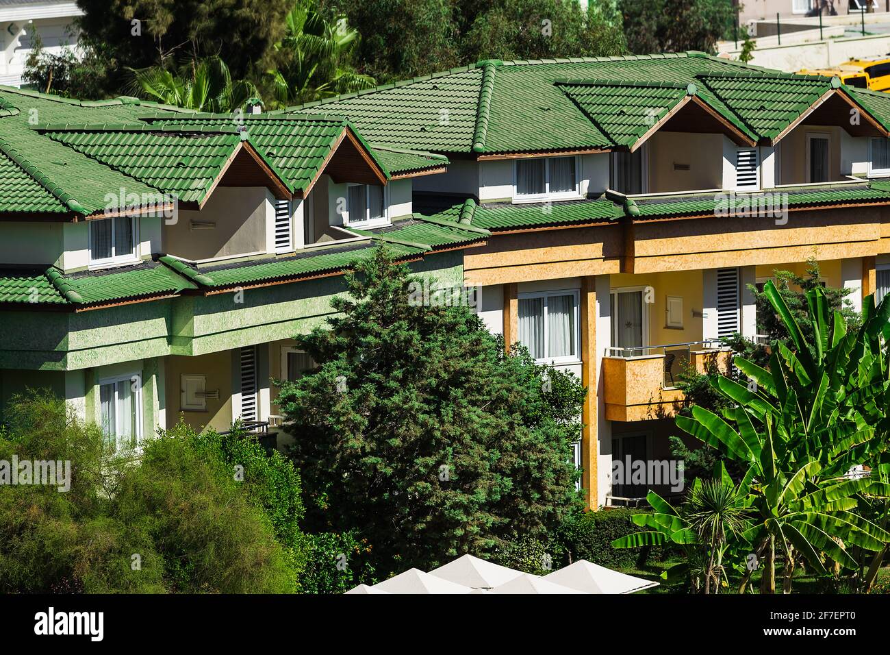hotel surrounded by tropical plants. hostel, motel Stock Photo - Alamy