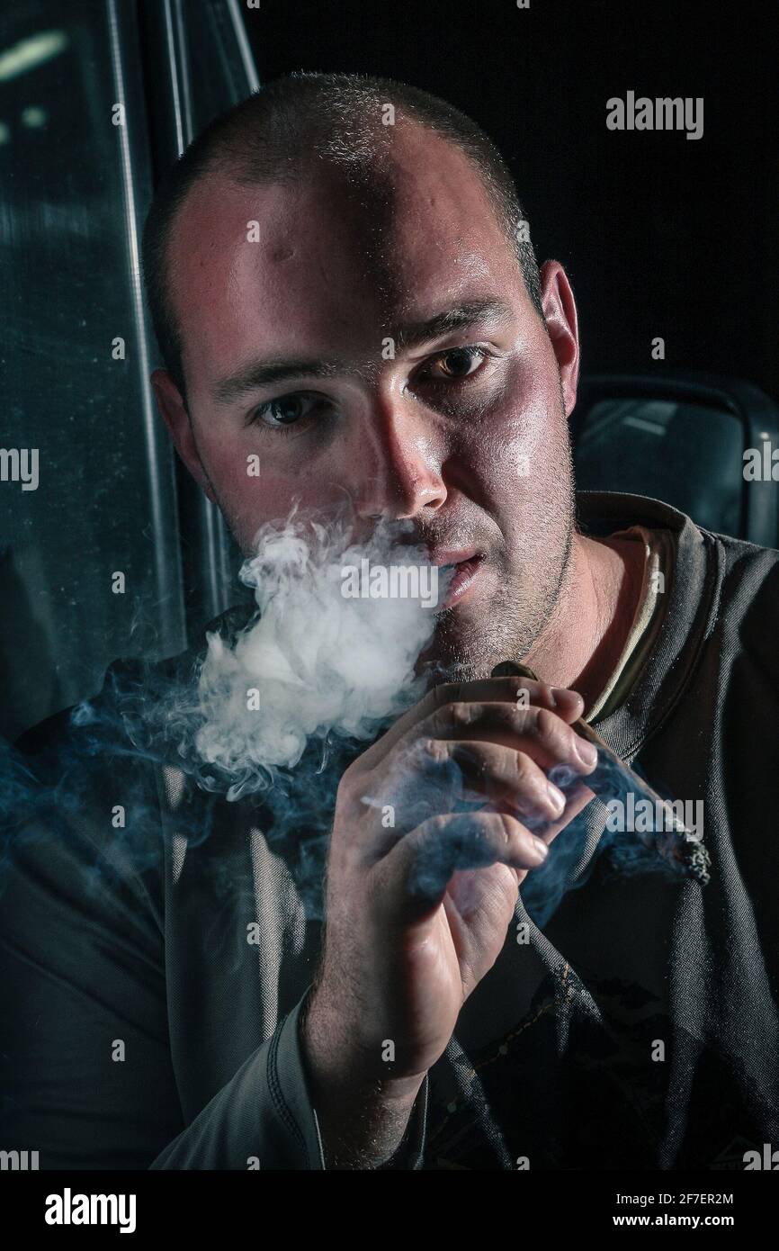 Exhaling Cigar Smoke