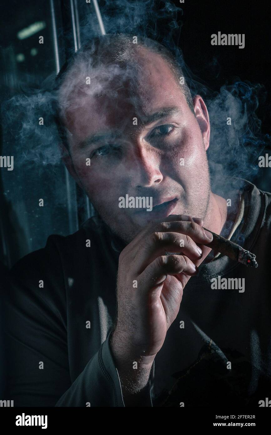 Blowing smoke in face hi-res stock photography and images - Alamy