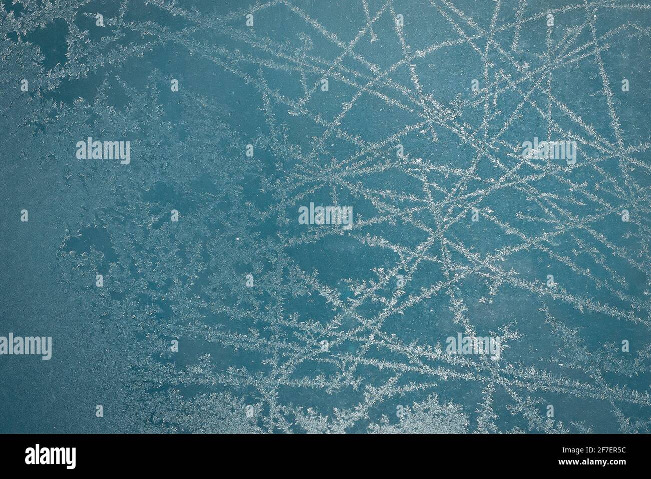Frost pattern on glass of a window. Frozen ice forming during the cold ...