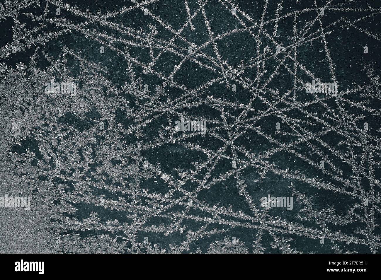 Frost pattern on glass of a window. Frozen ice forming during the cold ...