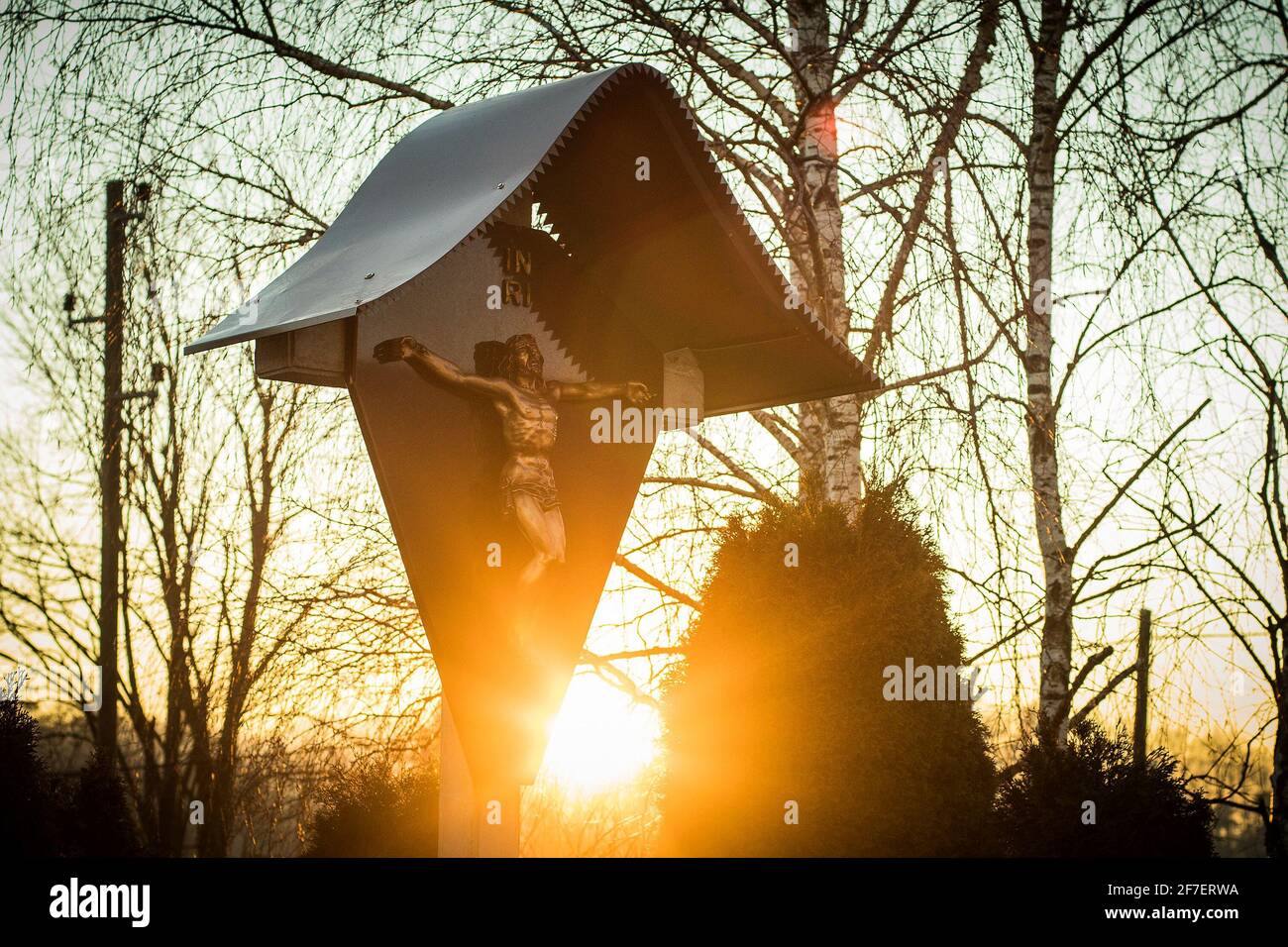 Crucifix of Jesus on the cross with wooden background and a roof ...