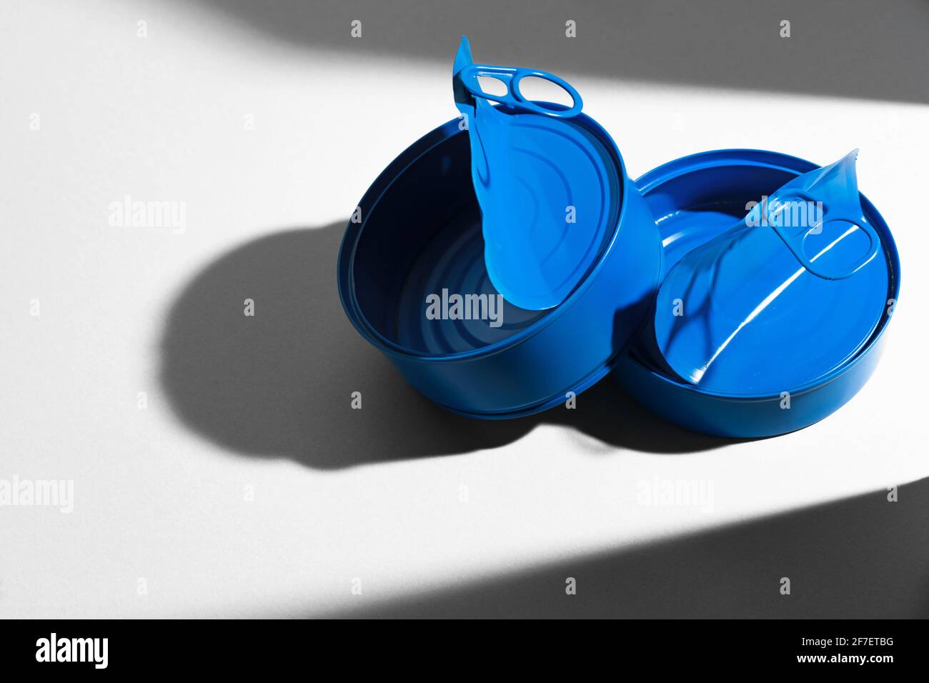 Painted blue opened tin can with ring on white background Stock Photo ...