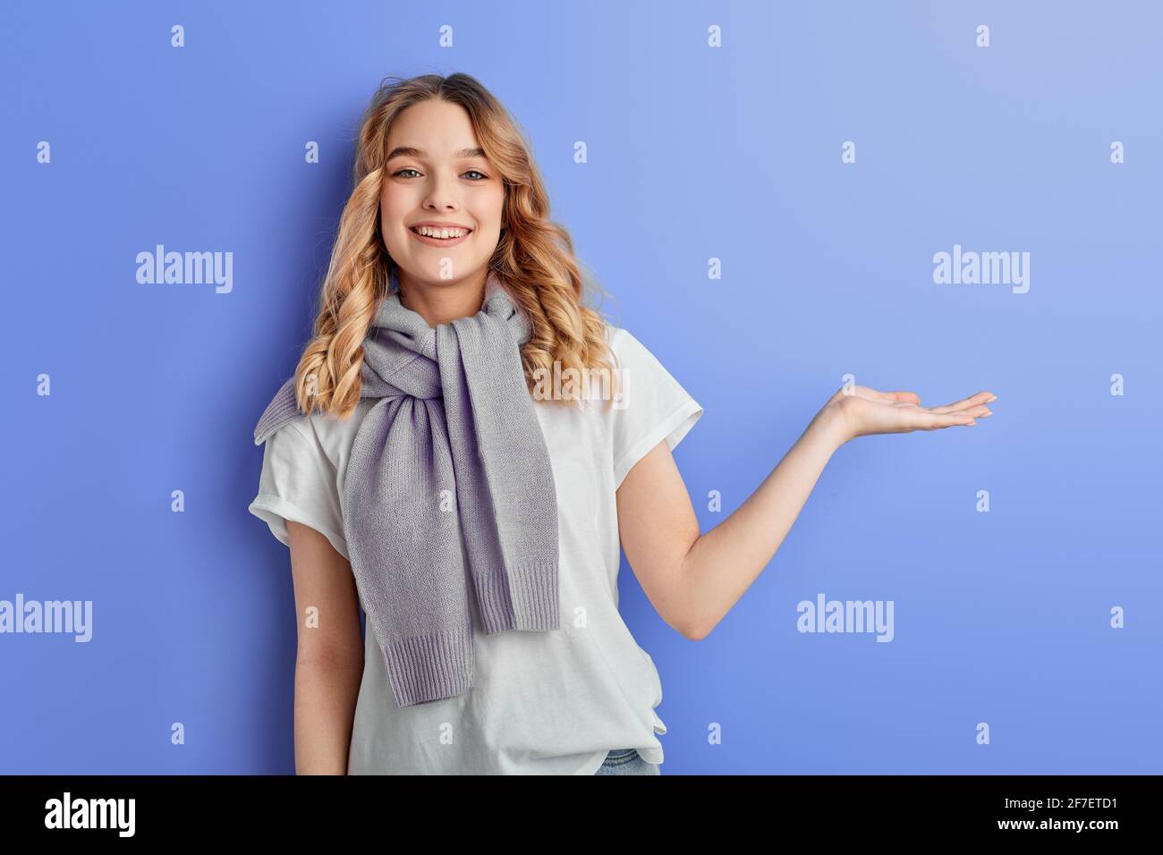 young woman presenting something, female showing open hand palm with ...