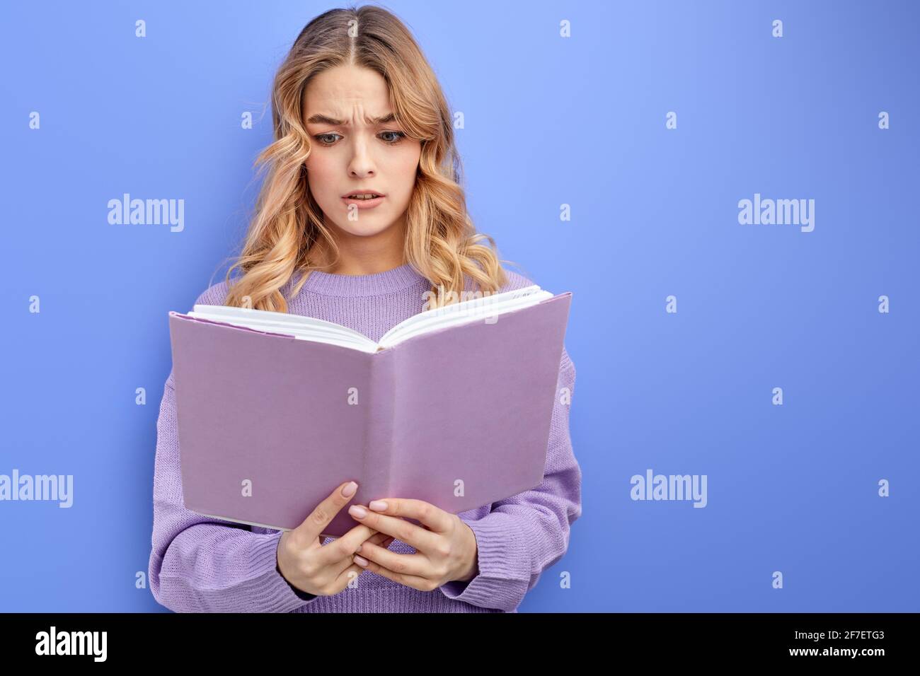 teen student girl misunderstanding the plot of book while doing ...