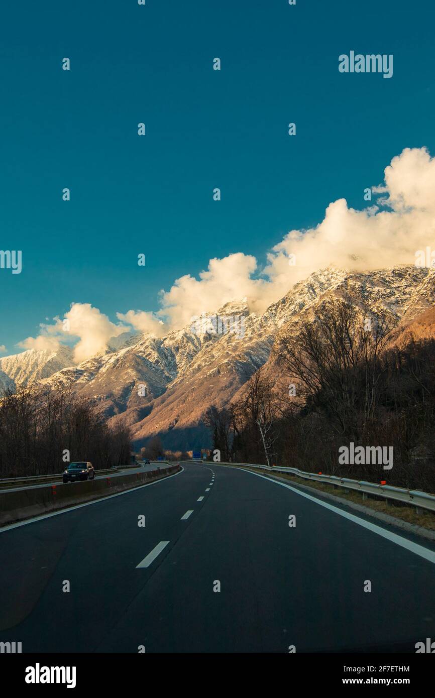 Road to simplon pass in italy, rising slowly up into the hills Stock ...