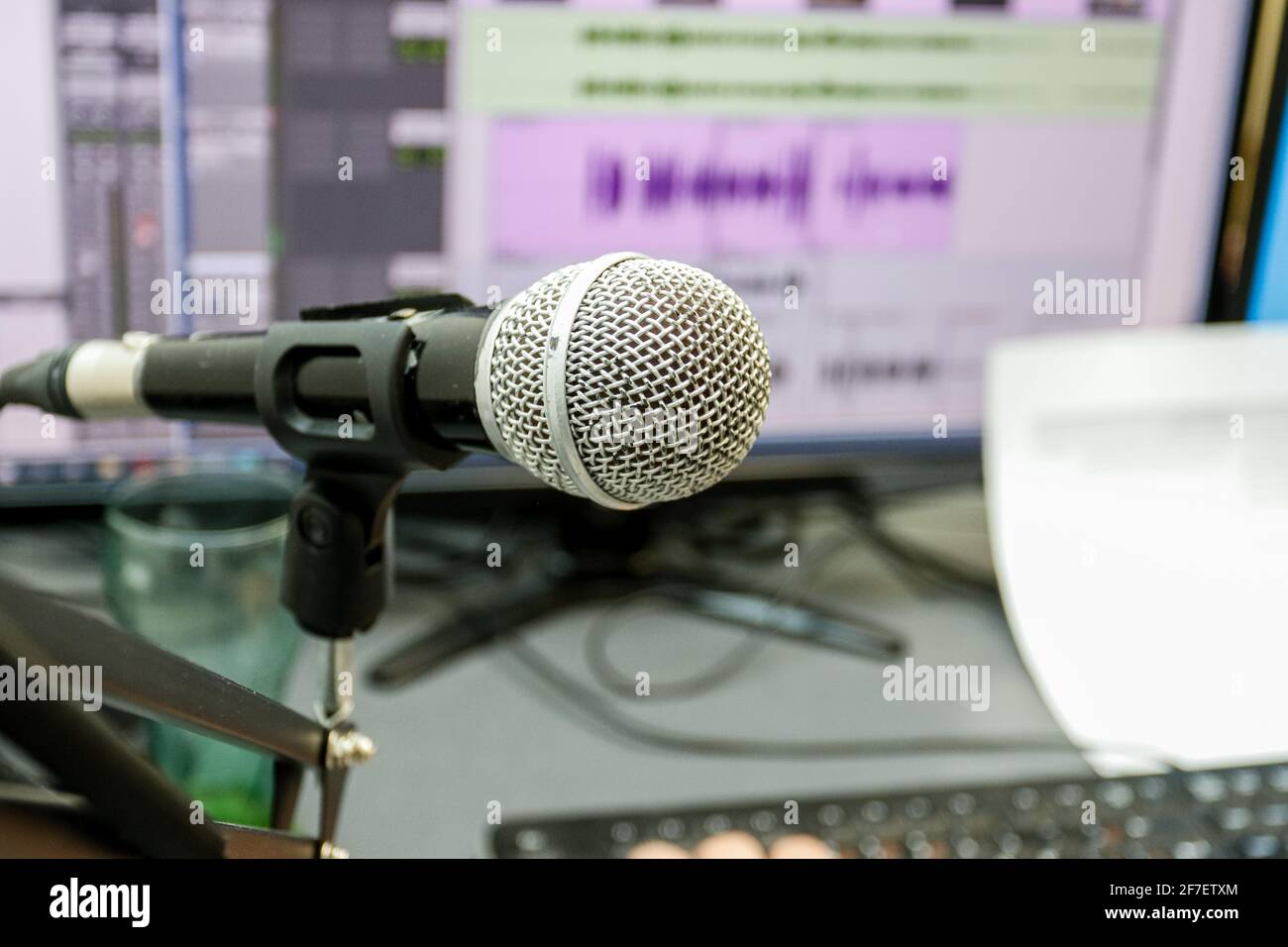 Microphone on the background of a computer monitor. Home recording ...