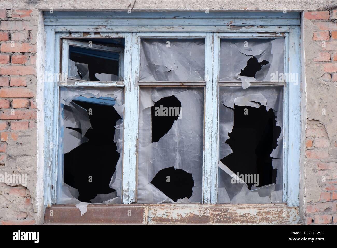 the window of a brick house with broken glass Stock Photo - Alamy