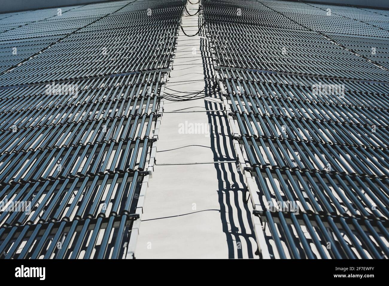 Round tubular solar panels installed on a roof of a building Stock ...