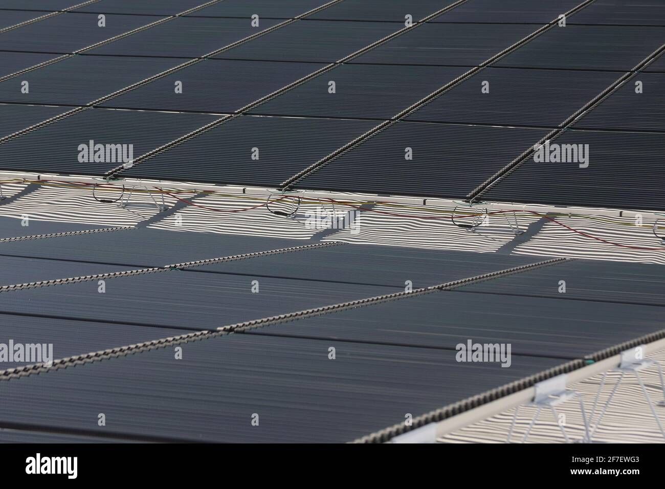 Round tubular solar panels installed on a roof of a building Stock ...