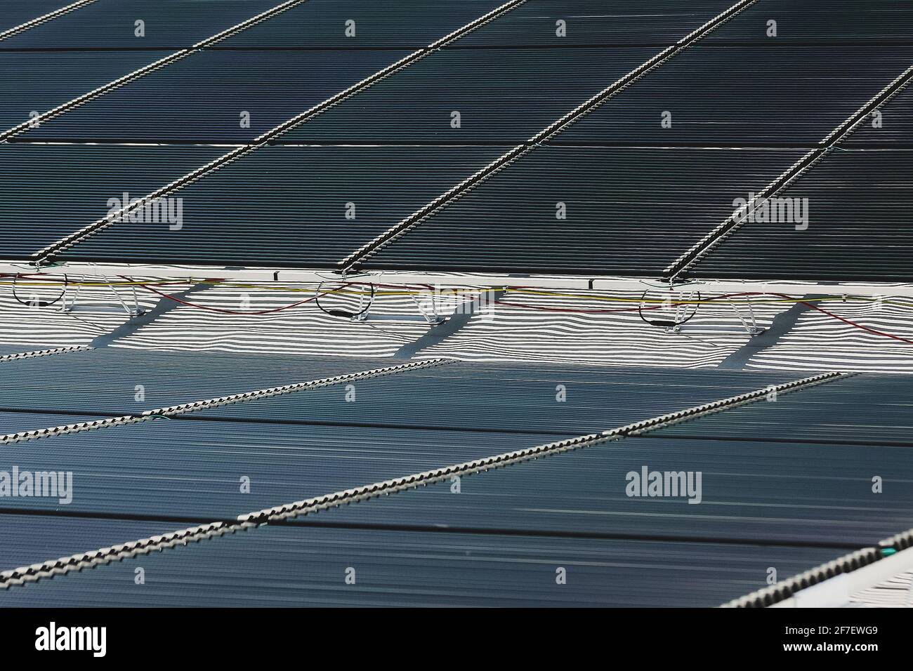 Round tubular solar panels installed on a roof of a building Stock ...