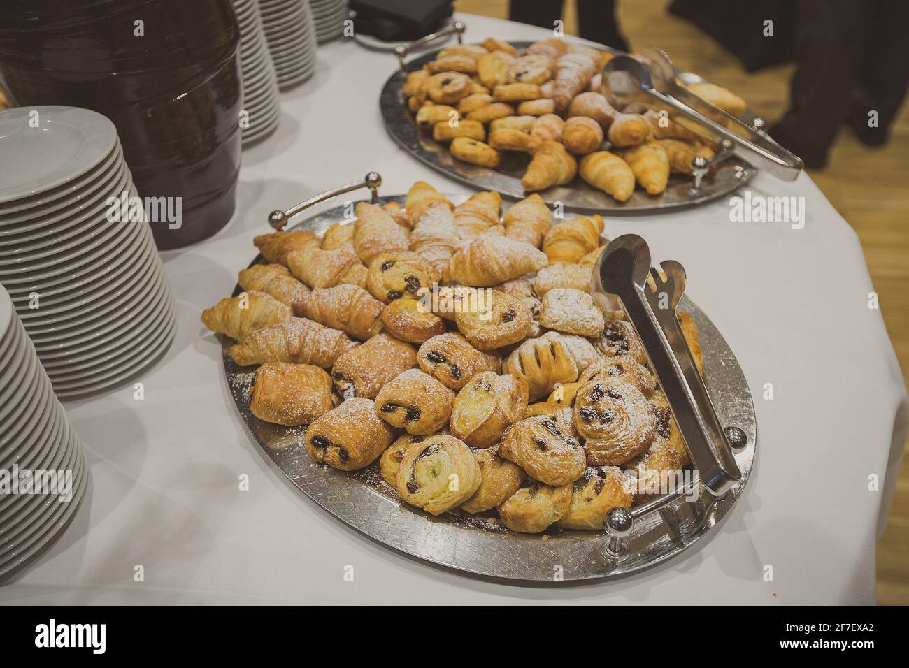 Croissants and other pastry products on a display at a conference or a ...