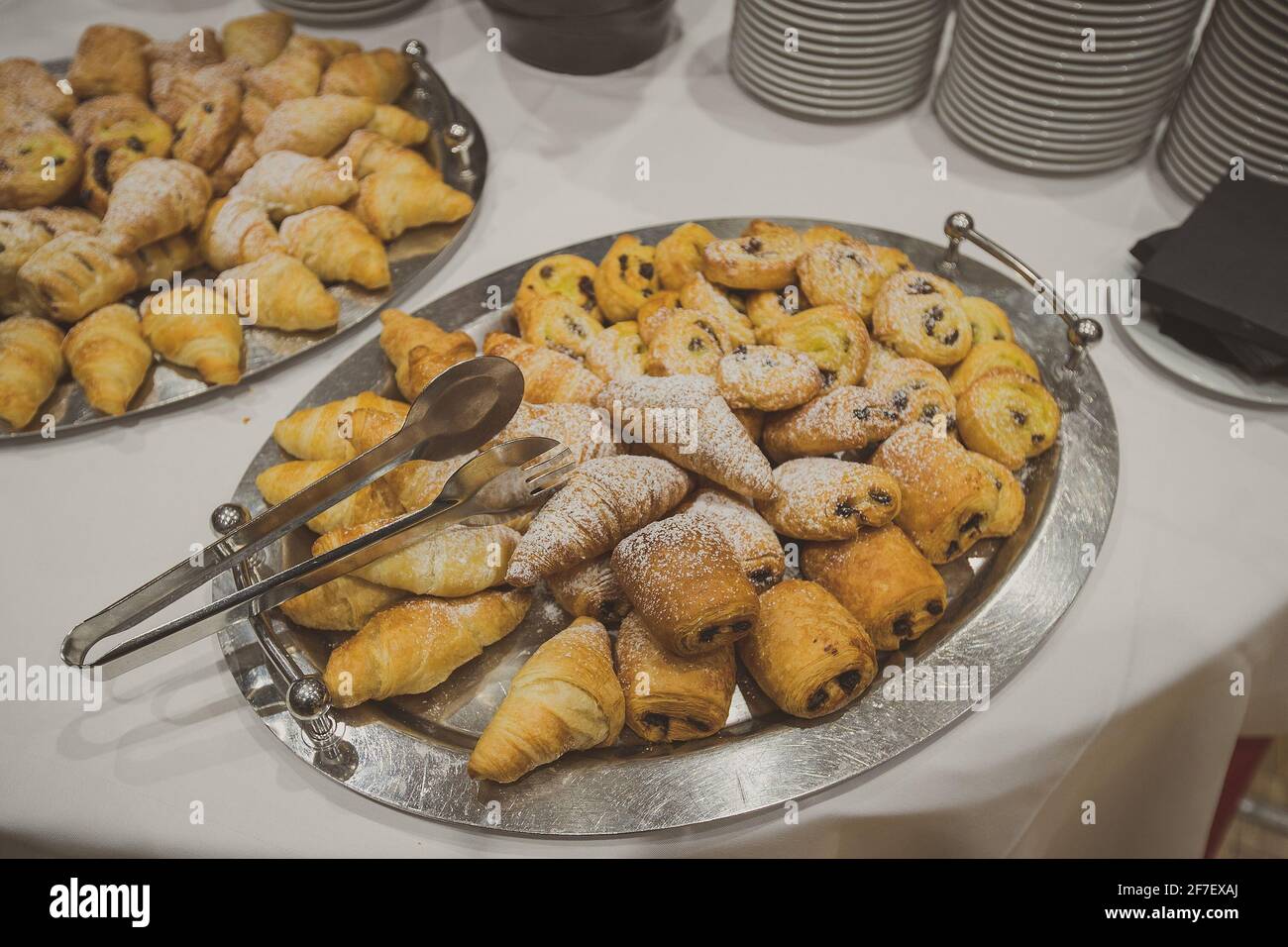 Croissants and other pastry products on a display at a conference or a ...