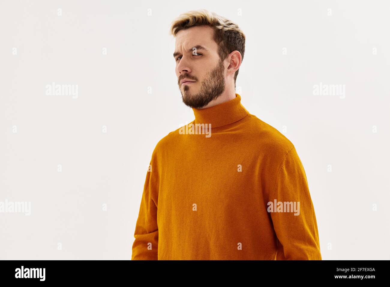 Man with suspicious look yellow hi-res stock photography and images - Alamy