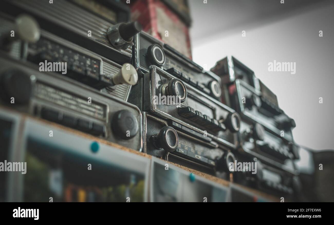 Vintage old timer radios stacked on a shelf. Flea market style ...