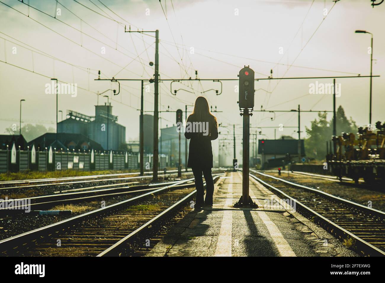 Beautiful girl on train tracks hi-res stock photography and images - Alamy