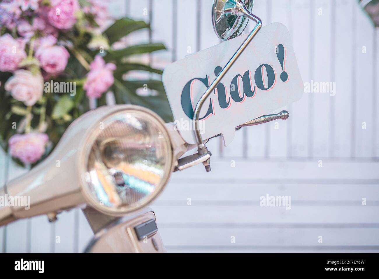 Word Ciao written on a bubble text board stuck behind the handlebar of ...
