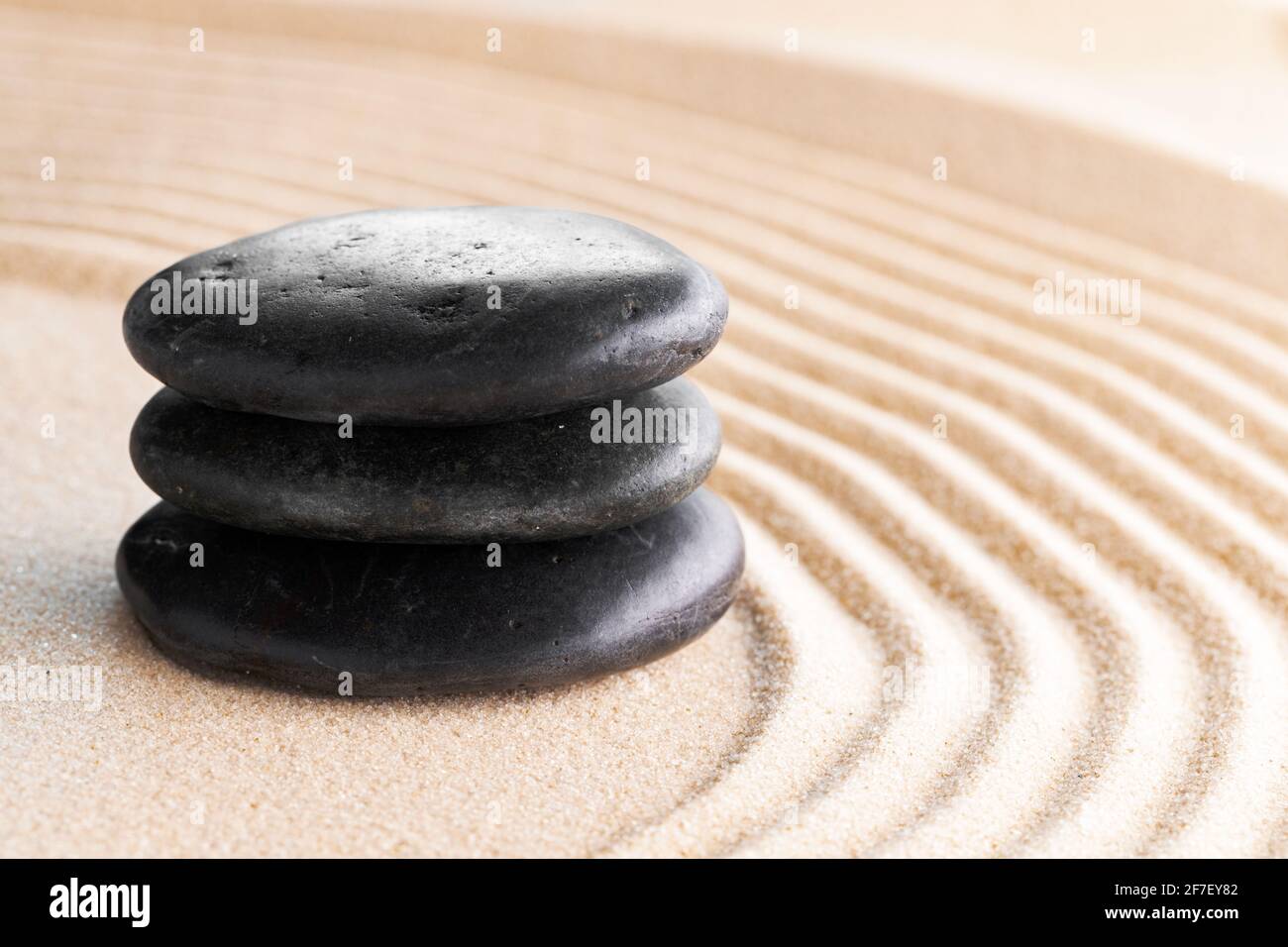 Japanese zen garden with stone in raked sand Stock Photo - Alamy