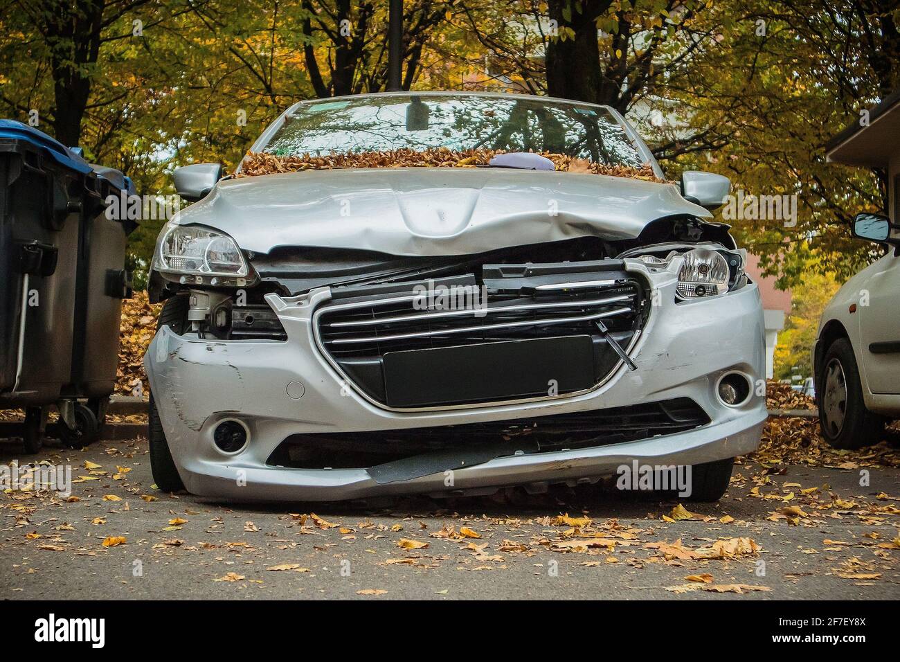 Frontal part of a small city vehicle smashed. Demolished and crashed ...