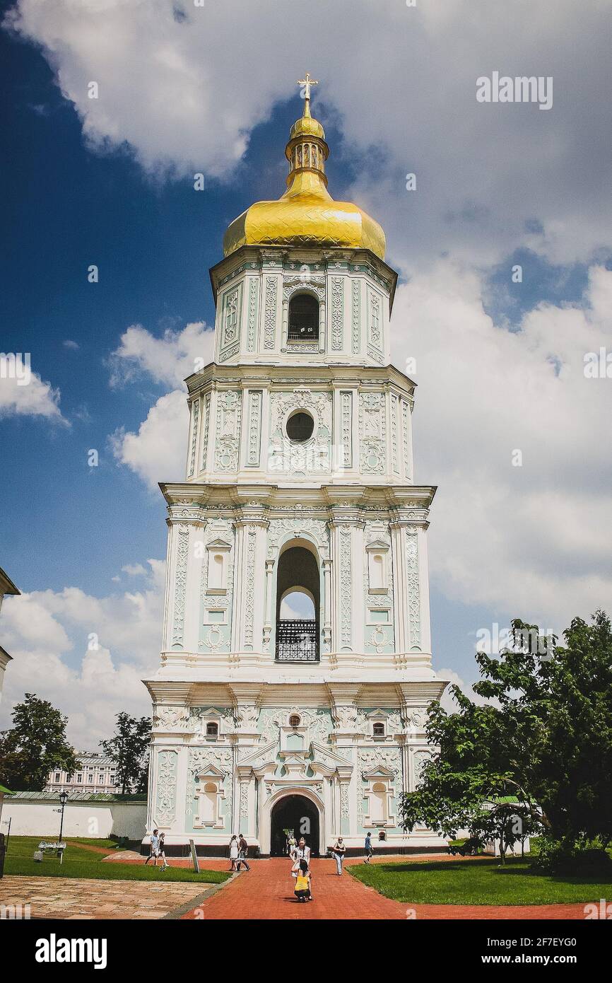 Bell tower of St. Michael monastery. Big white tower with blue ...