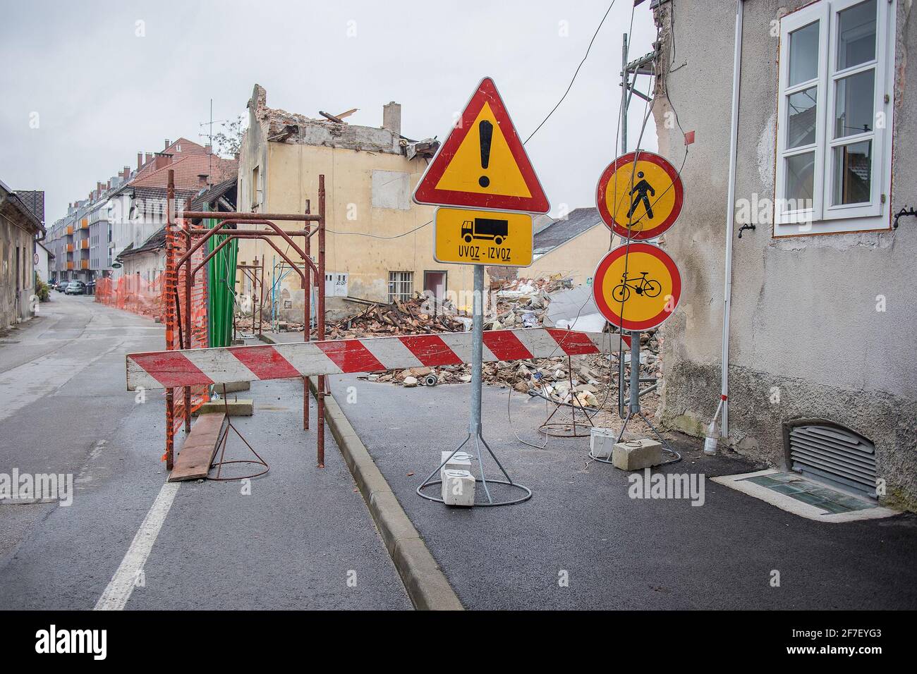 Traffic road signs in front of a construction site or demolishing of a ...