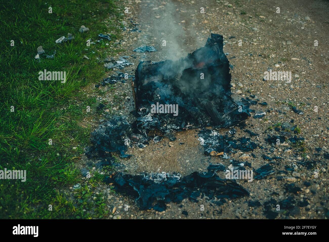 Leftovers of fake cardboard grill which was burning hard. Cardboard ...