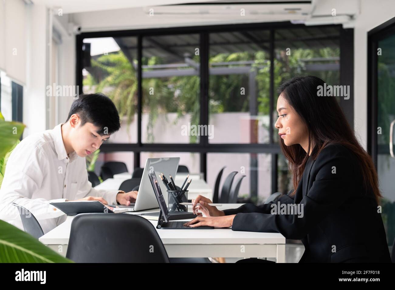 Group of young asian business people working with laptop computer at ...