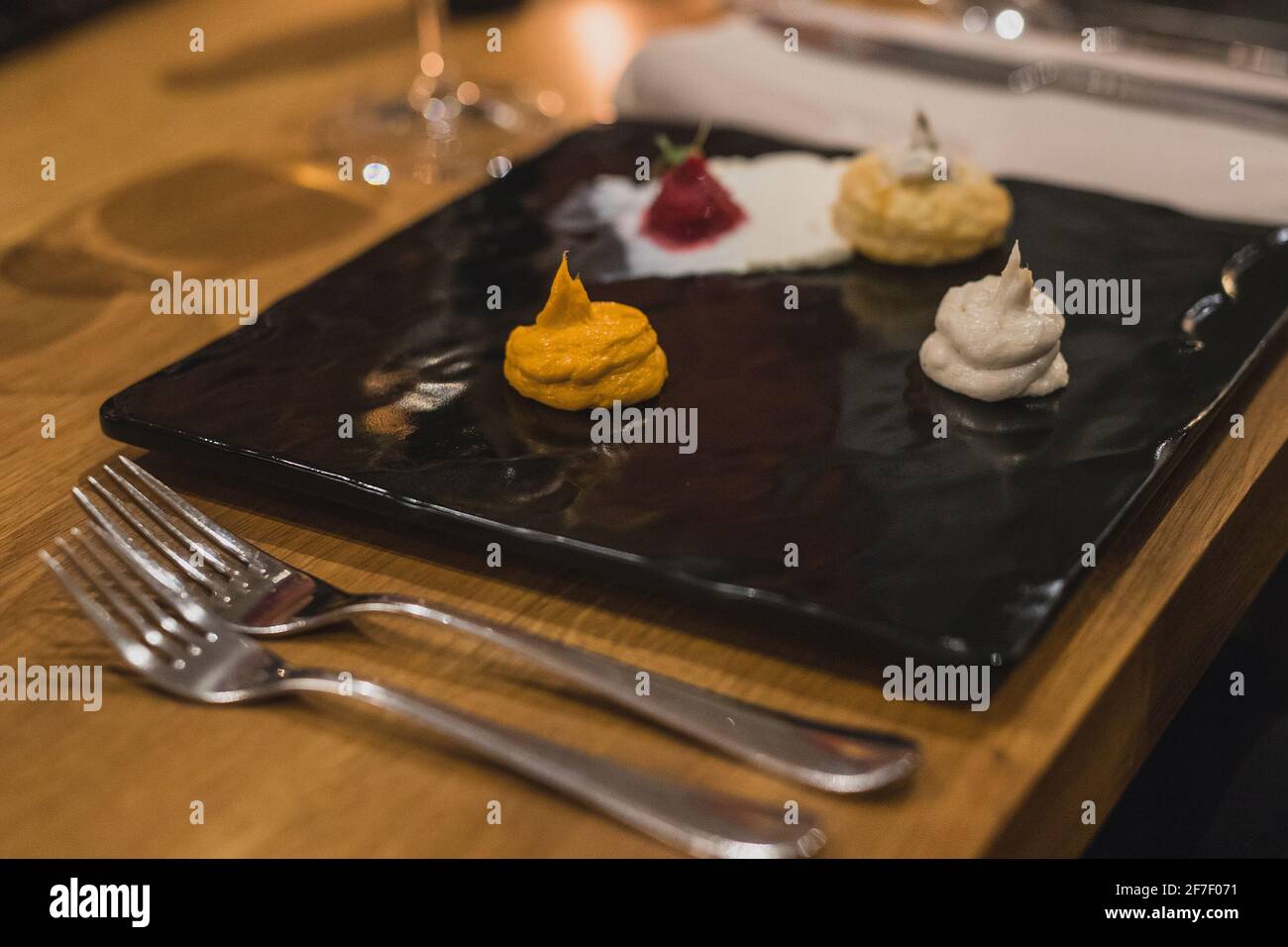 A selection of different bakala or bakalar spread on a fancy black ...