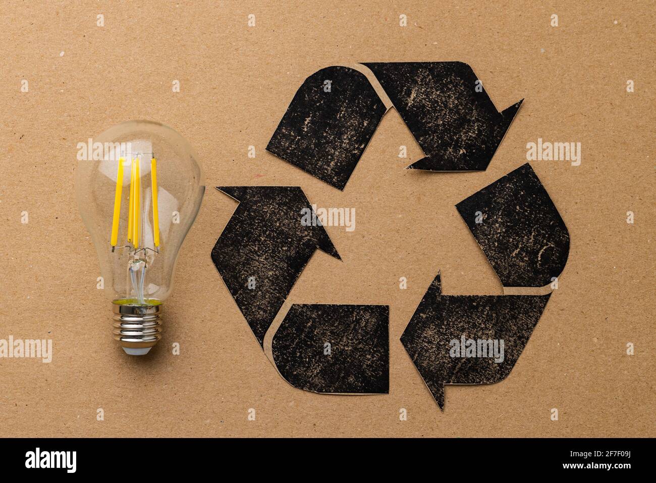 LED light bulb with recycle symbol on craft paper Stock Photo - Alamy