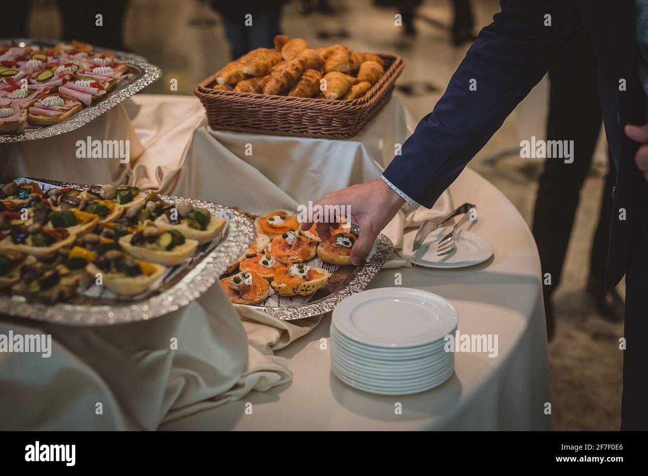 A collection of different snacks and sandwiches on a display on a ...